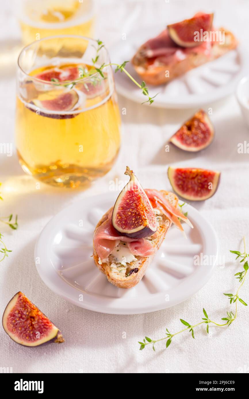 Small canape snack, crostini with ham, fig and apple wine, Italian ...
