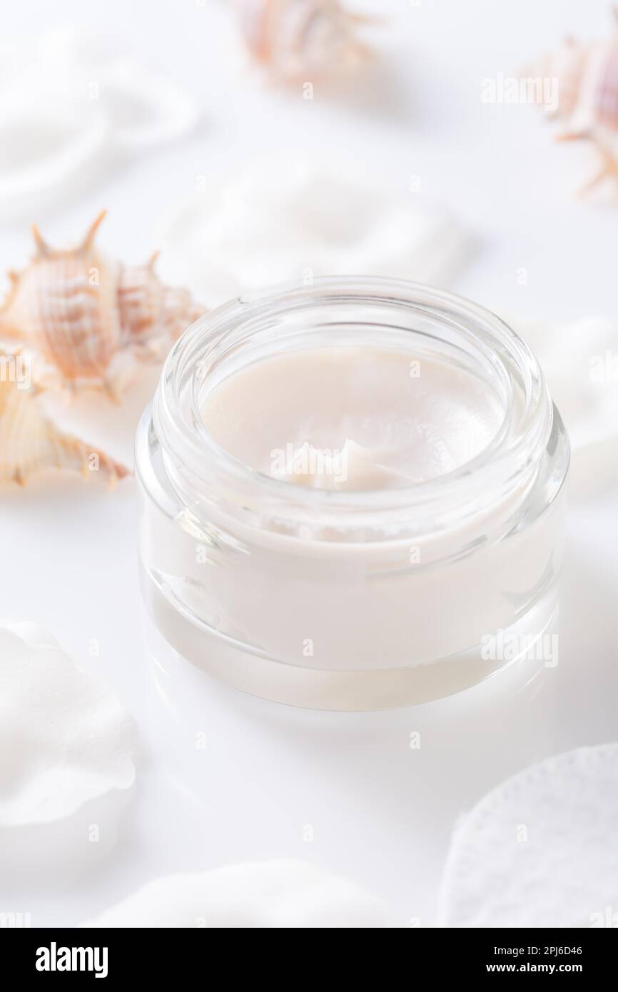 Open container with skin and body cream. Nourishing oil for clean and ...