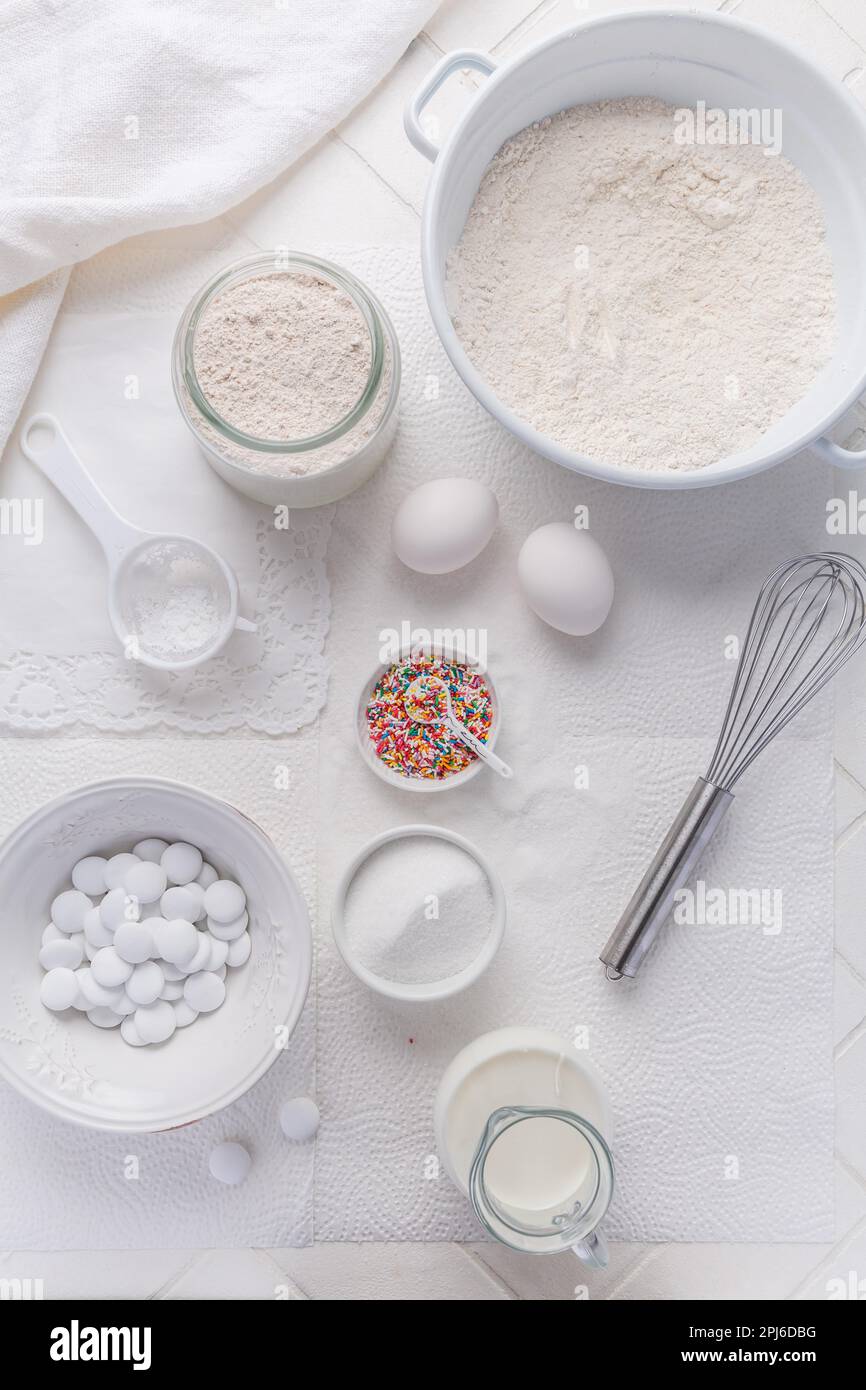 Baking background with flour, eggs, sugar sprinkles, kitchen tools ...