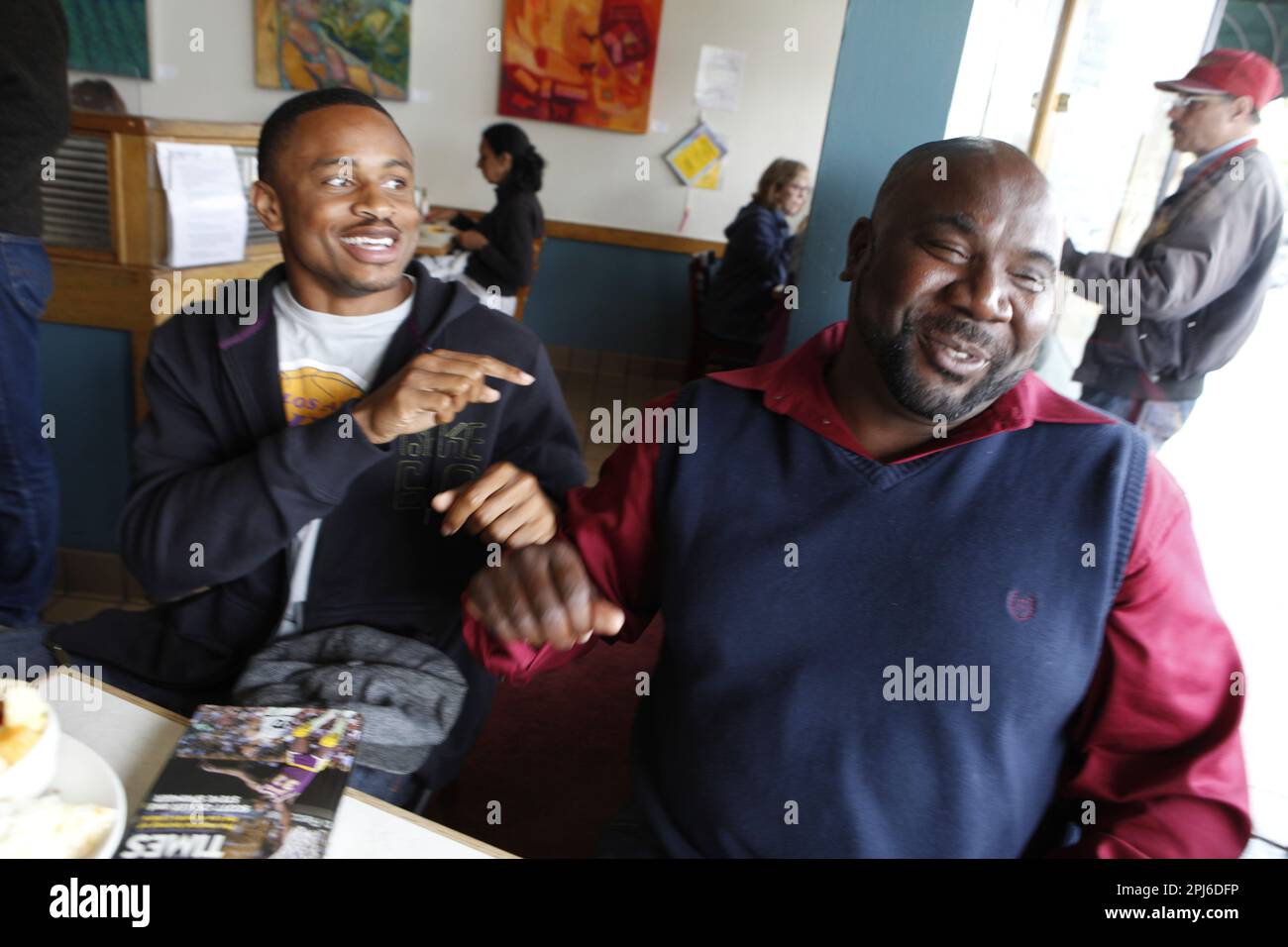 Raiders cornerback Nnamdi Asomugha (l to r) shares a laugh with East ...
