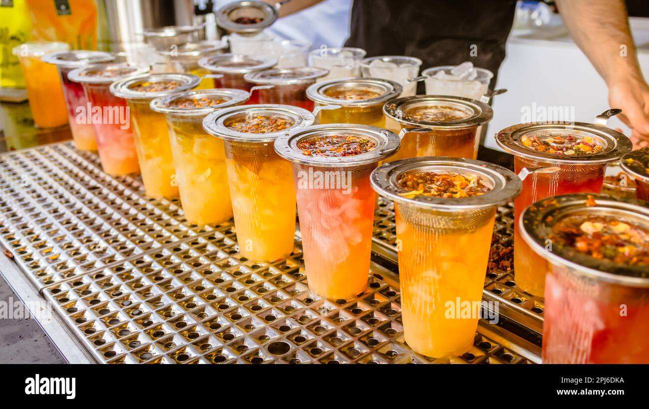 Preparing fresh brewed ice tea. Street food and refreshment Stock Photo ...