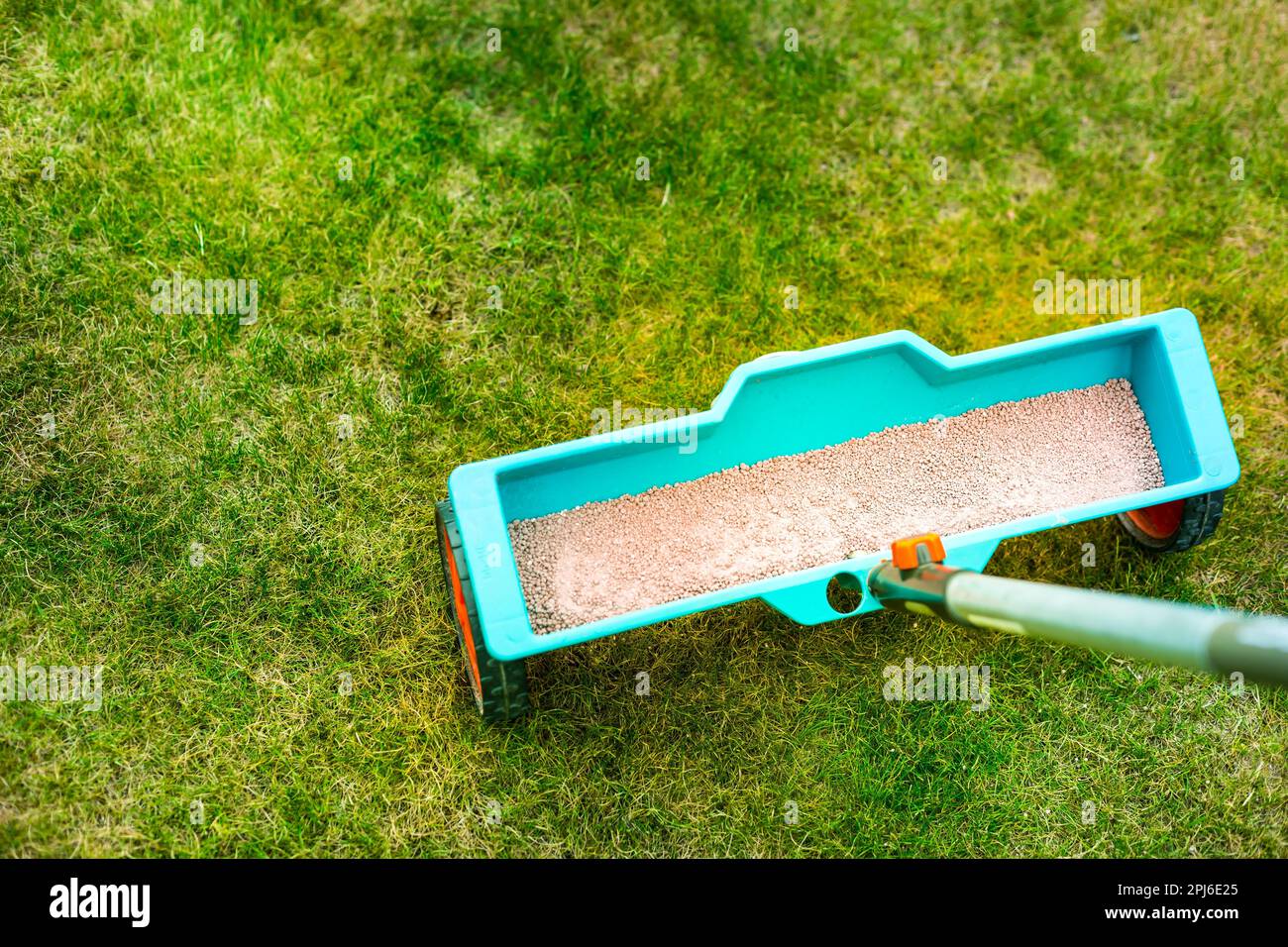 Lawn care - Lawn Spring Fertilization tool Stock Photo - Alamy
