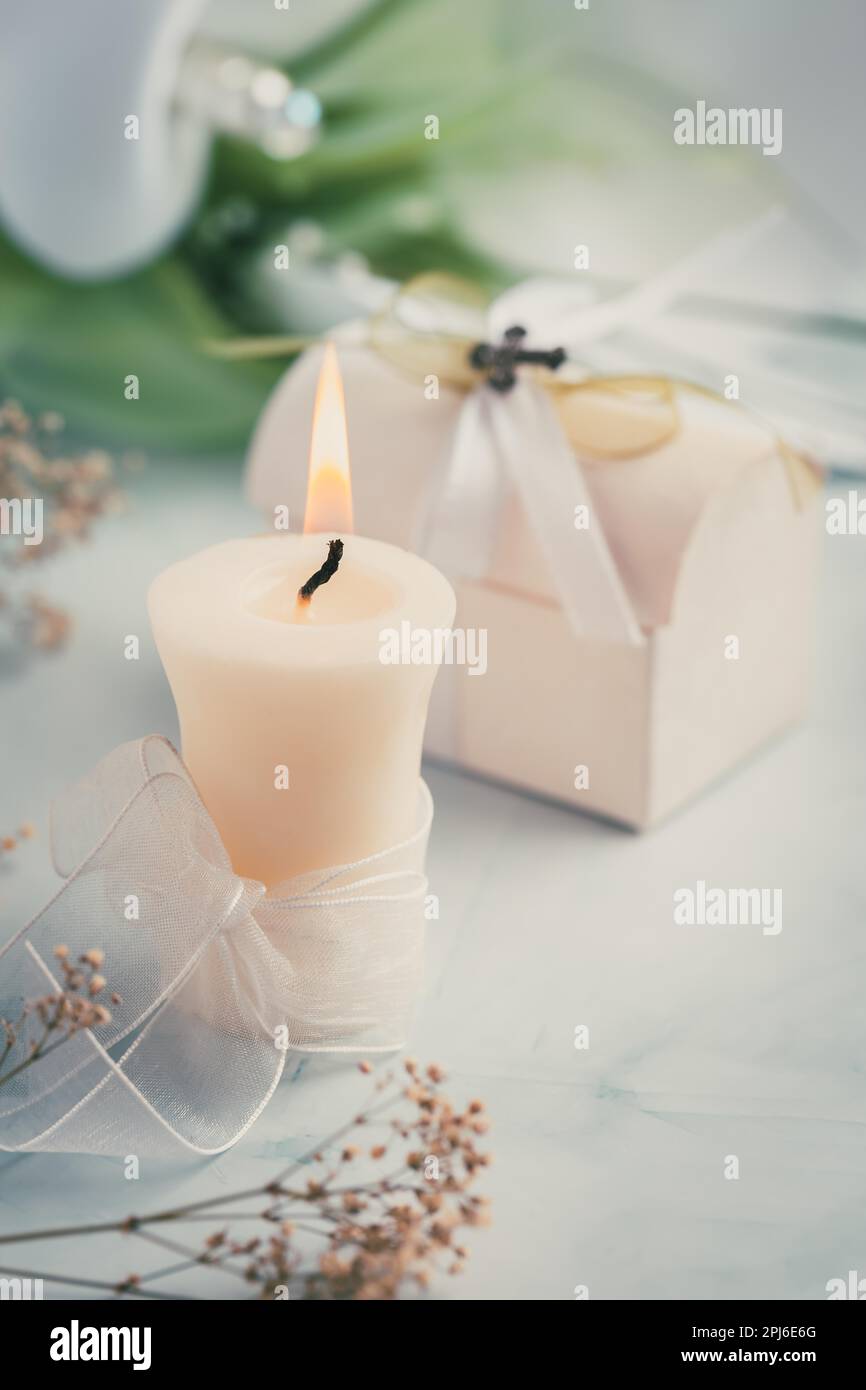First holy communion or confirmation - candle with flowers and small ...