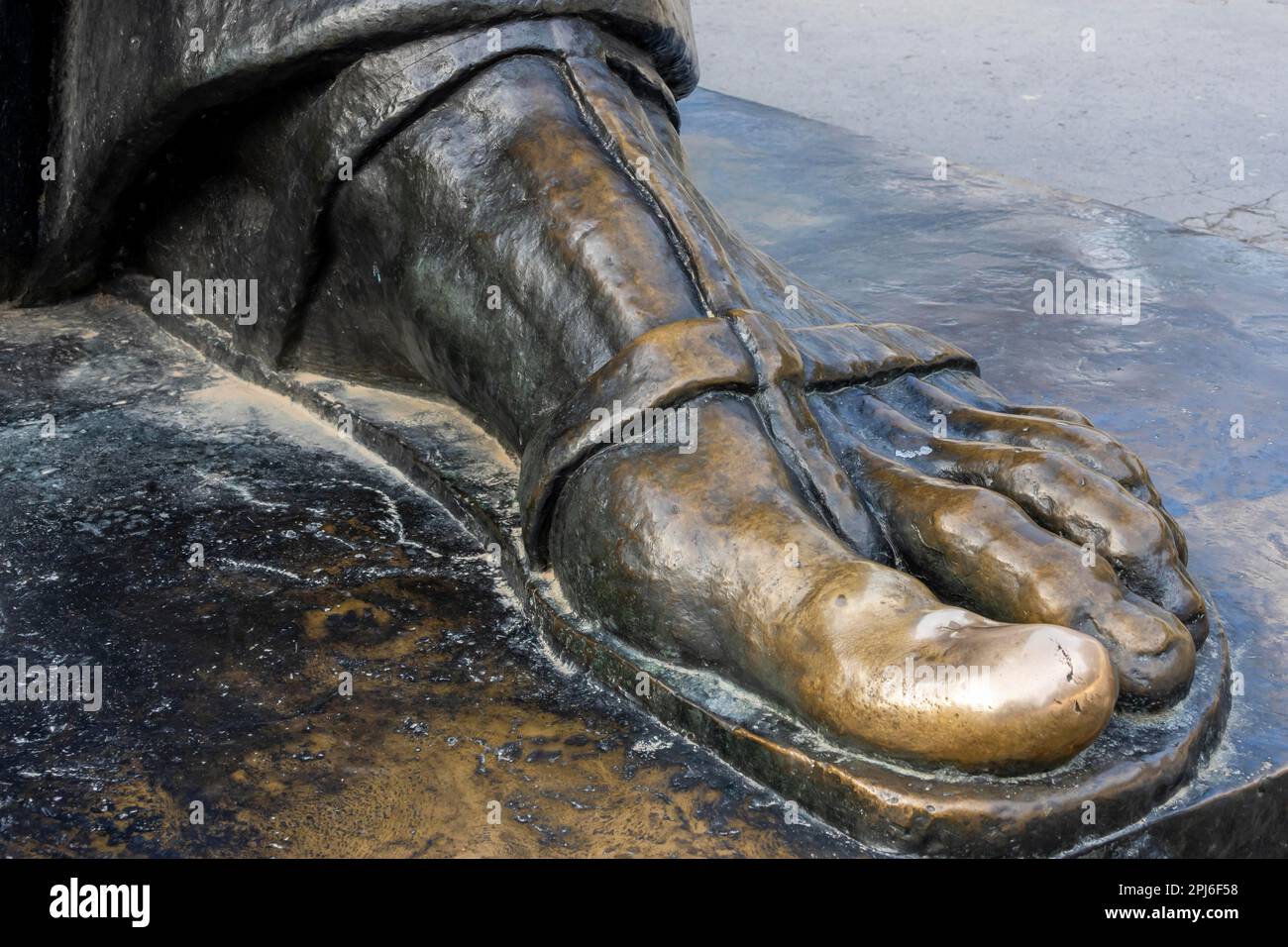 The giant foot of the bronze sculpture of Gregory of Nin and the shiny ...