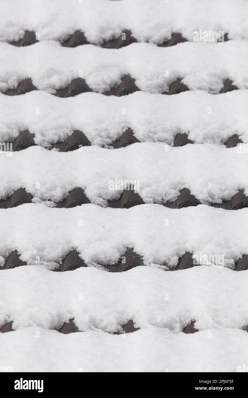 Snowy roof tiles on a roof in winter, wallpaper, Germany Stock Photo ...
