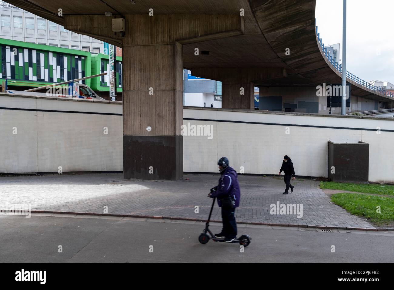 Escooter passes by underneath the elevated section of the A38 Aston ...