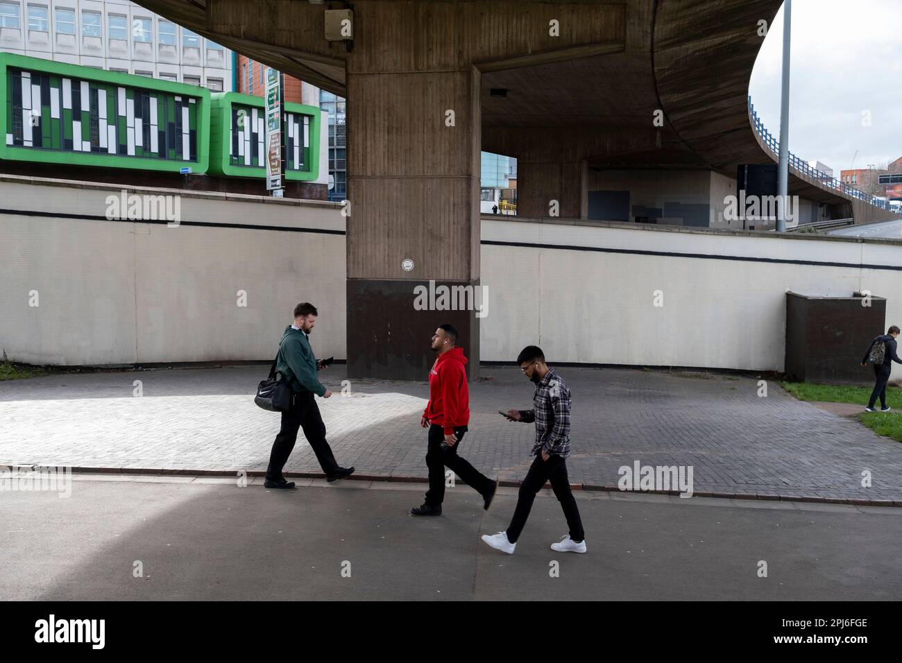 People pass by underneath the elevated section of the A38 Aston ...