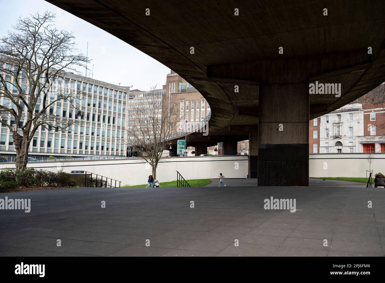 People pass by underneath the elevated section of the A38 Aston ...