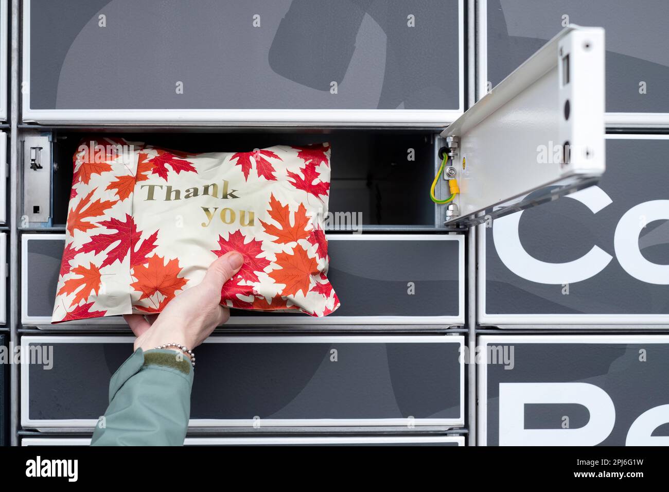 A customer delivers or collects a parcel to a inpost locker after ...