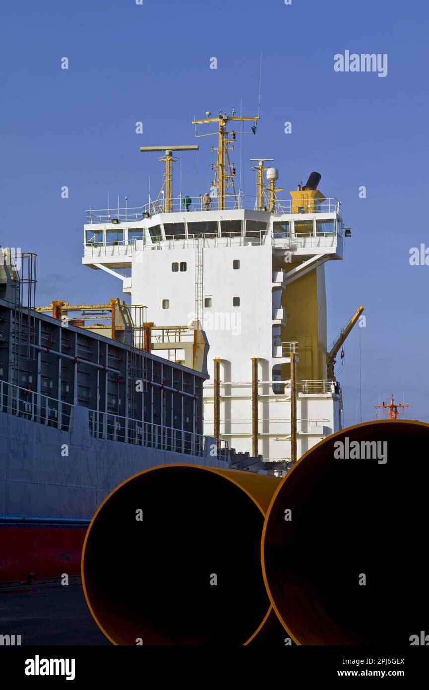 Natural gas pipes in front of loading, cargo ship Stock Photo - Alamy