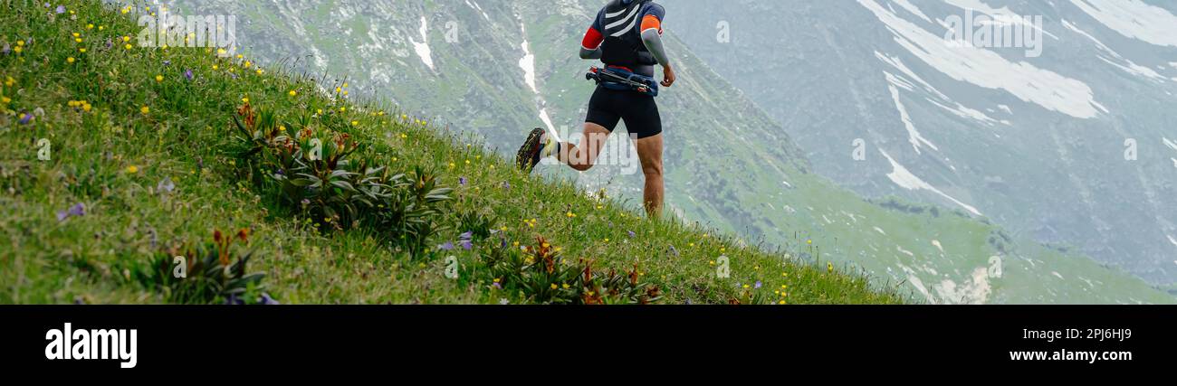 male runner run down mountain trail, skyrunning race ultramarathon ...
