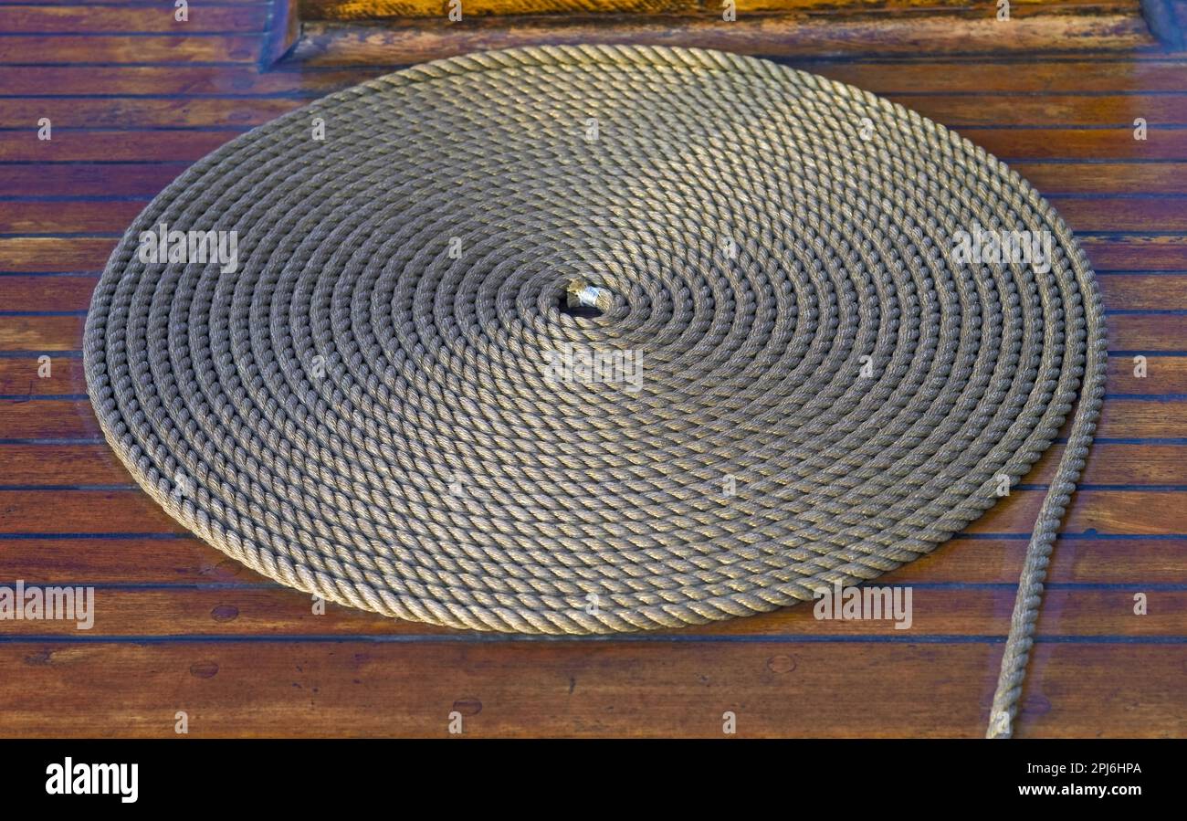 Rolled-up rope on board a sailing vessel Stock Photo - Alamy