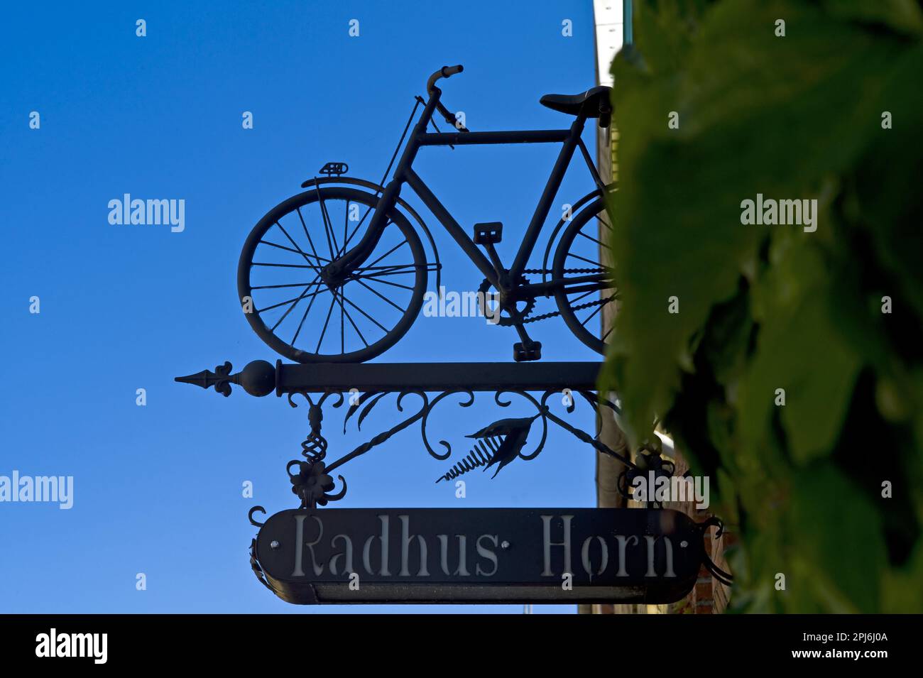 Outdoor advertising of a bicycle repair shop Stock Photo - Alamy