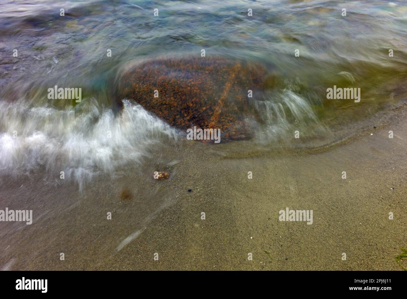 Stone on the shore, beach Stock Photo - Alamy