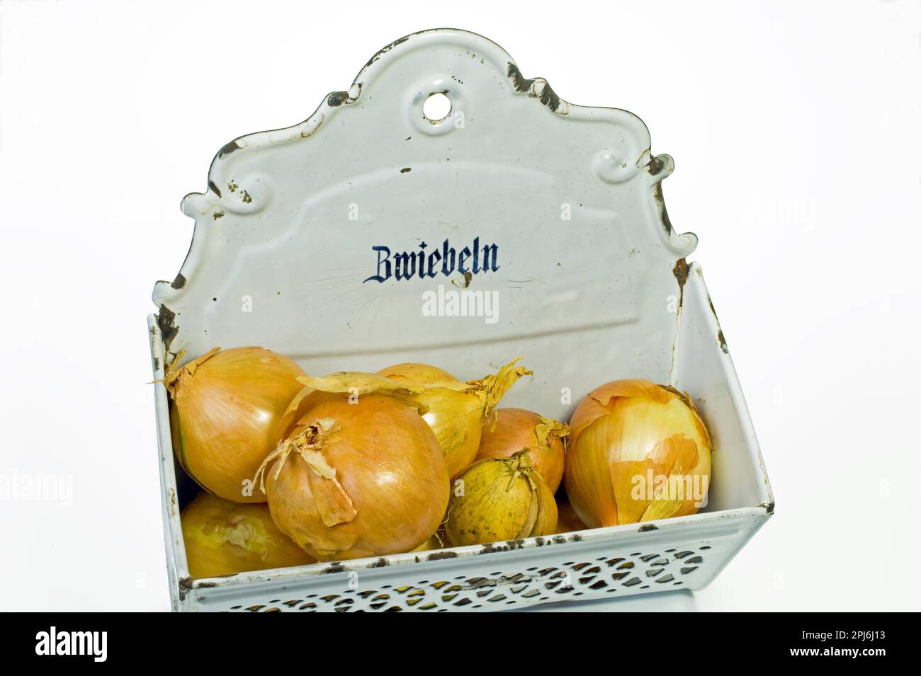 Onions in a metal onion box Stock Photo - Alamy