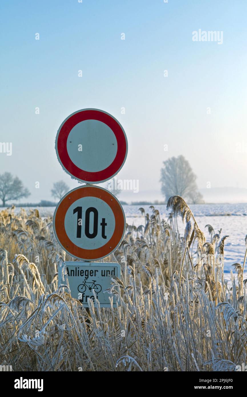Traffic signs in winter Stock Photo - Alamy
