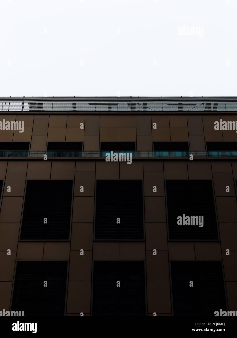 Dark building facade. Modern exterior of brown colored house ...