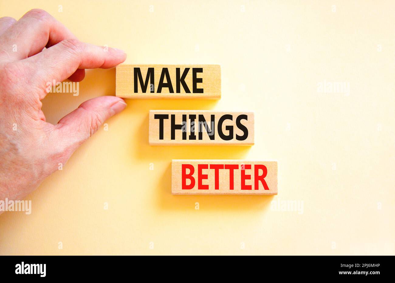 Make things better symbol. Concept words Make things better on wooden block on a beautiful white ...