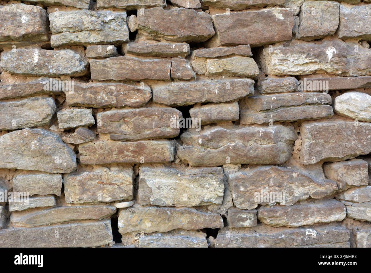 Old wall built of natural stone tiles Stock Photo - Alamy