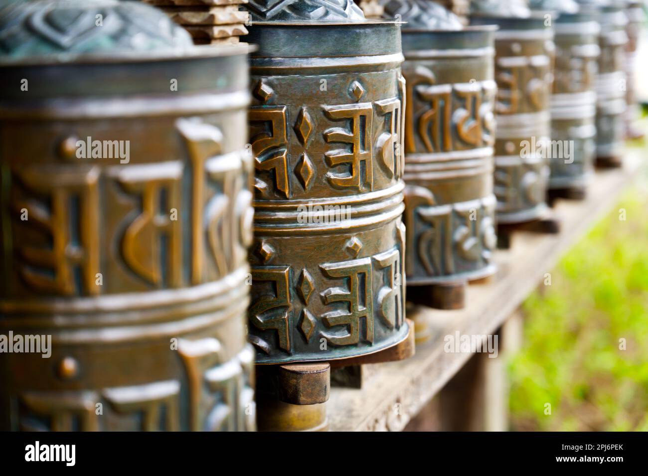 Prayer wheels or mani wheel photo (translation mantra Om mani padme hum ...