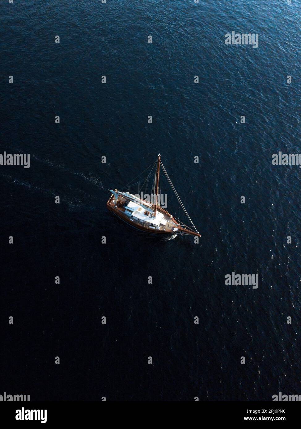 Sailboat gliding across ocean hi-res stock photography and images - Alamy