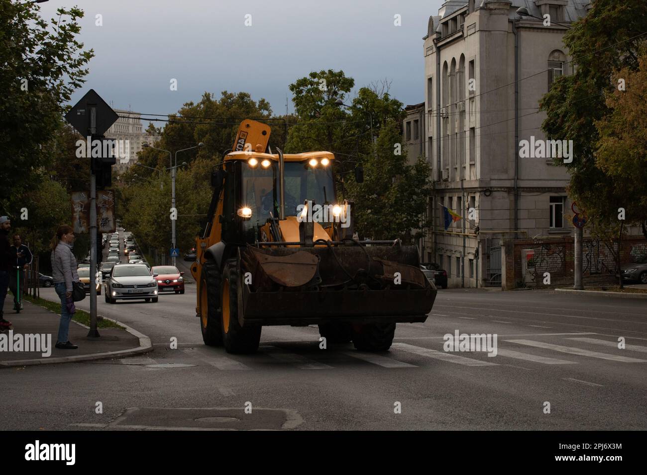 Construction workers at construction site and heavy duty bulldozer in ...