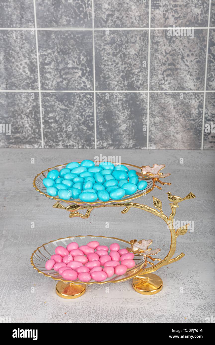 Colorful almond candies in the stylish, crystal candy bowl, almond ...