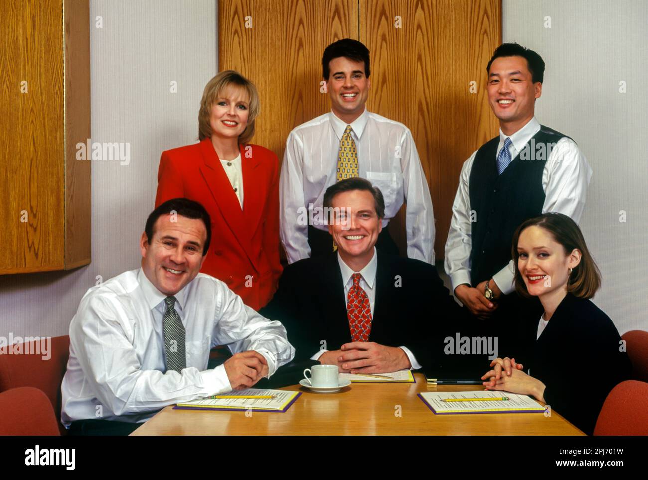 1996 HISTORICAL GROUP OF OFFICE WORKERS MEETING AROUND TABLE Stock ...