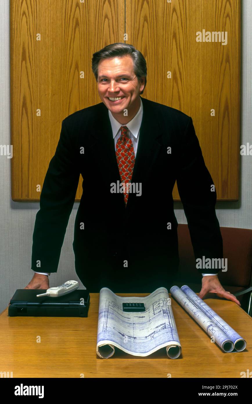 1996 HISTORICAL MALE OFFICE WORKER WITH CONSTRUCTION PLANS Stock Photo ...