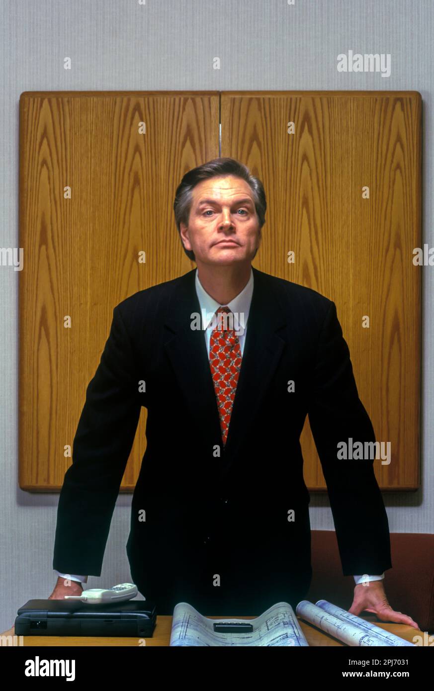 1996 HISTORICAL MALE OFFICE WORKER WITH CONSTRUCTION PLANS Stock Photo ...