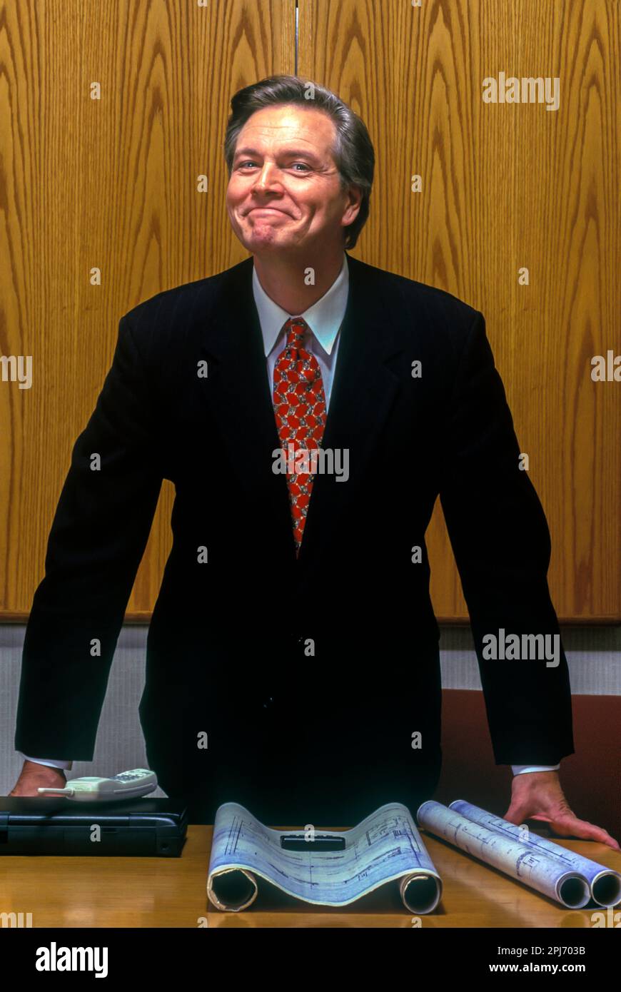 1996 HISTORICAL MALE OFFICE WORKER WITH CONSTRUCTION PLANS Stock Photo ...