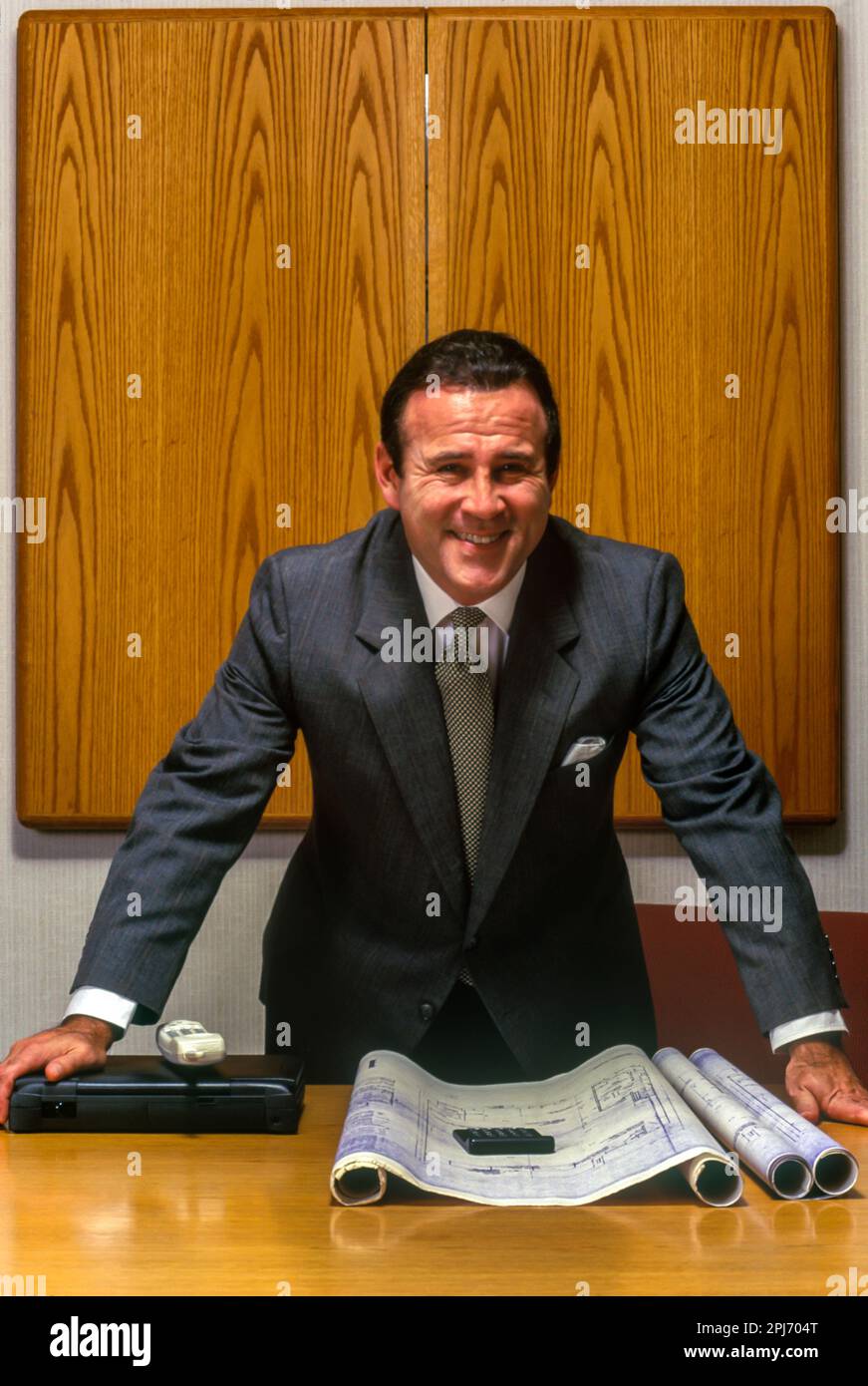 1996 HISTORICAL MALE OFFICE WORKER WITH CONSTRUCTION PLANS Stock Photo ...