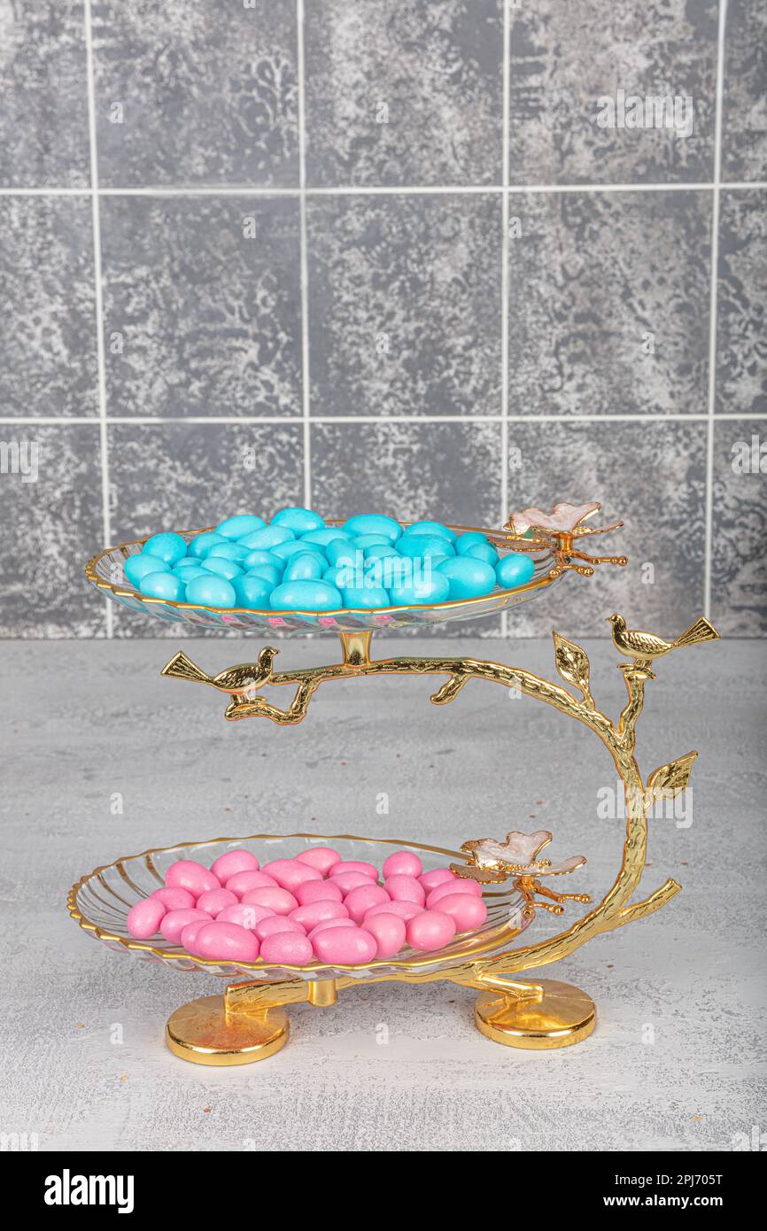 Colorful almond candies in the stylish, crystal candy bowl, almond ...