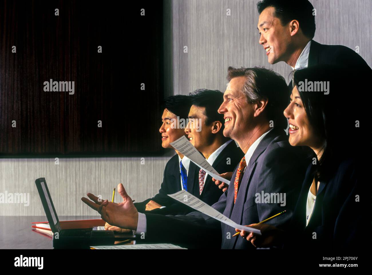 1996 HISTORICAL ASIAN EUROPEAN OFFICE WORKERS IN MEETING AROUND TABLE ...