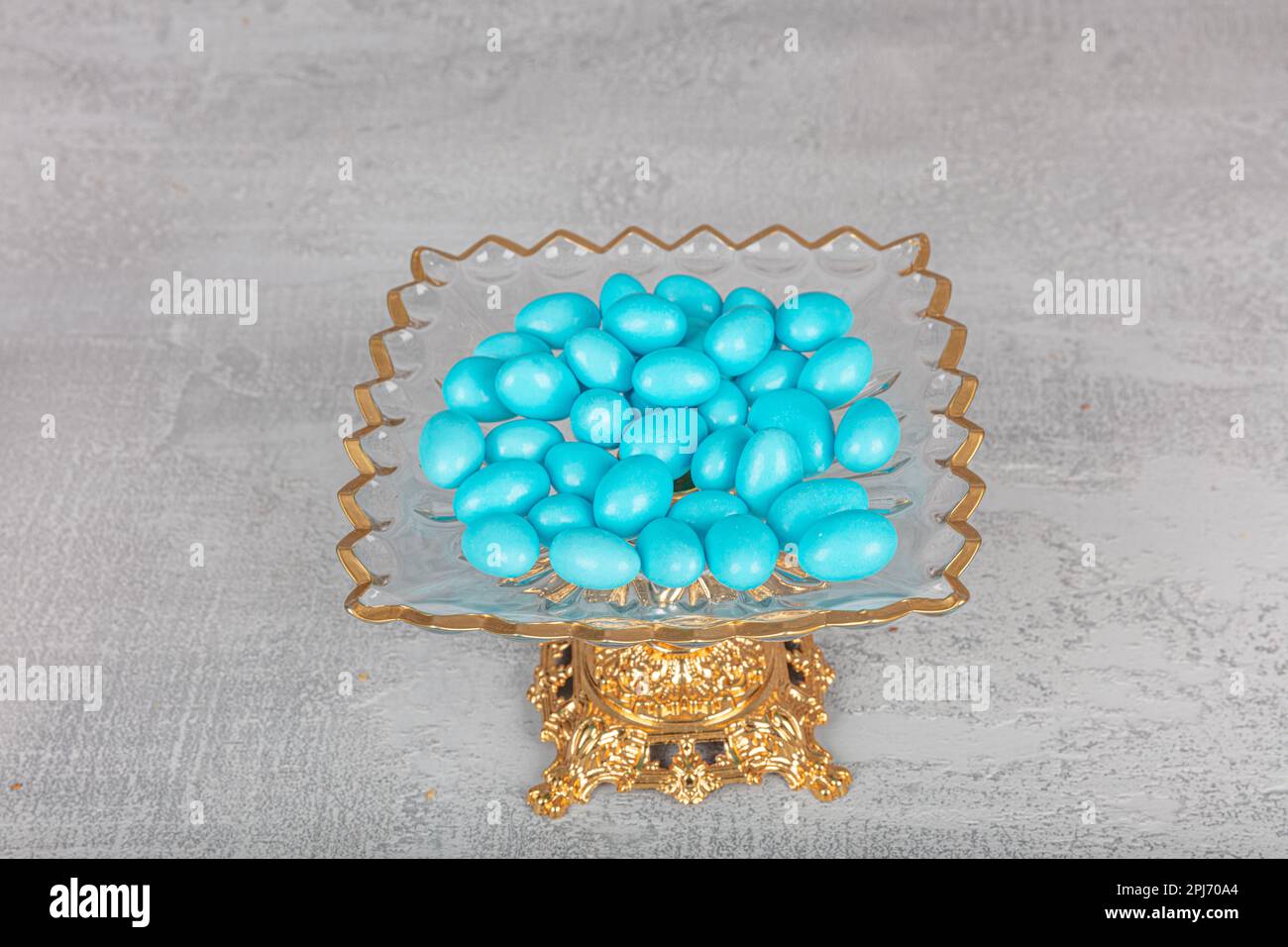 Colorful almond candies in the stylish, crystal candy bowl, almond ...