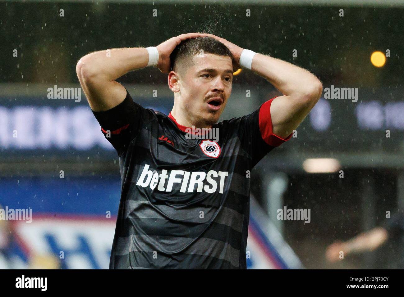 Waregem, Belgium. 31st Mar, 2023. Antwerp's Arbnor Muja looks dejected ...