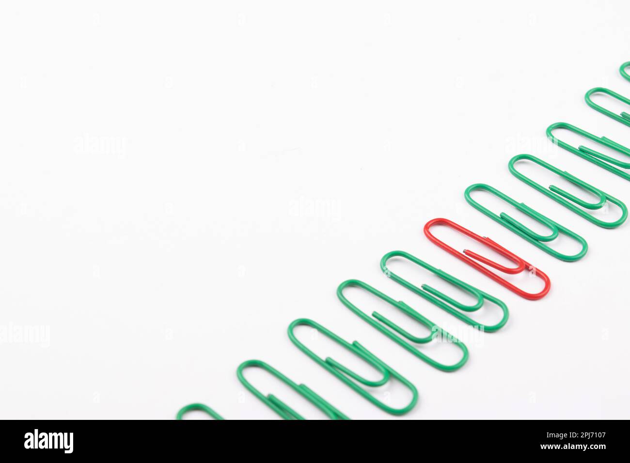 Paperclip on white background with text space Stock Photo - Alamy