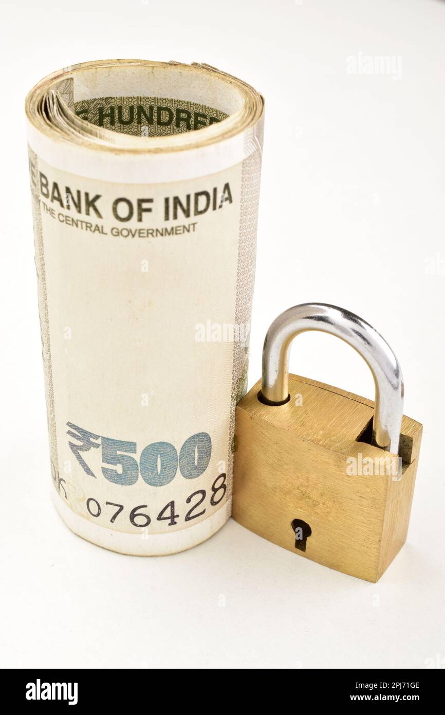 Indian currency note with lock on white background Stock Photo - Alamy