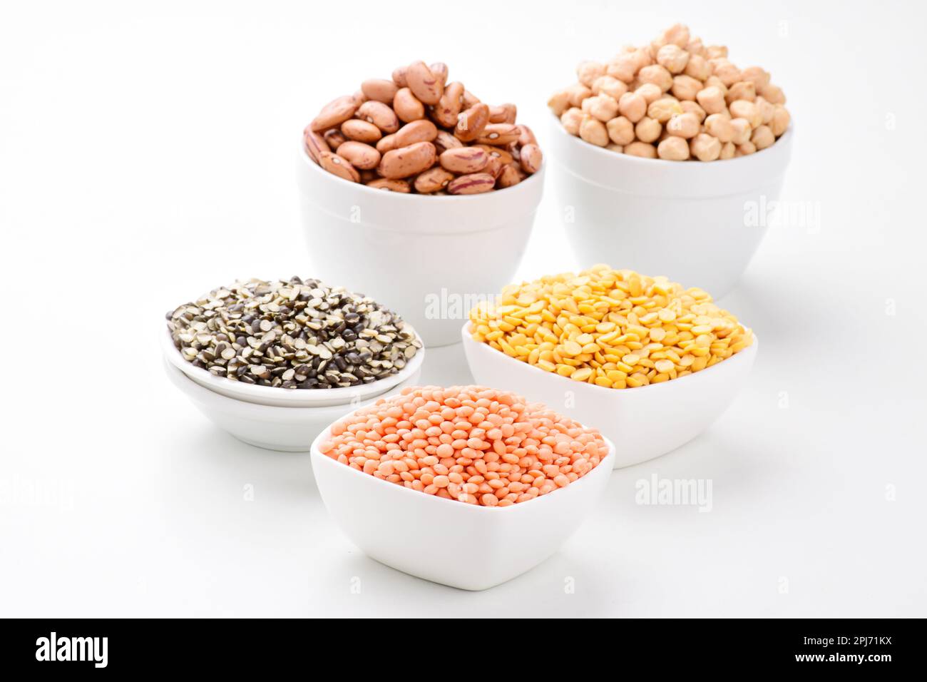 Uncooked red lentils with kindey beans and chana dal isolated on white ...