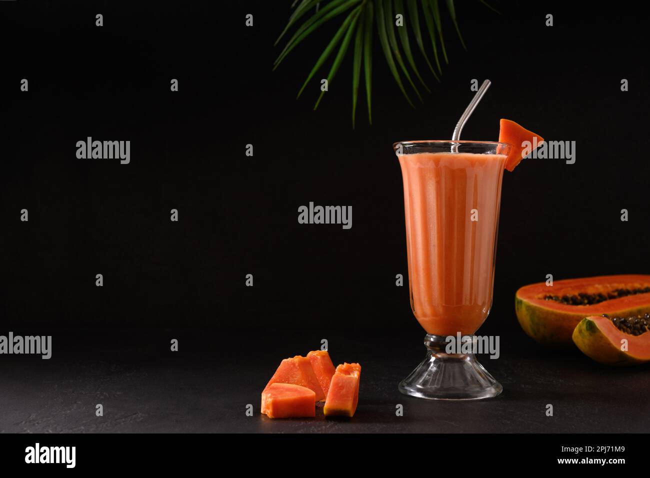 Asian traditional Papaya lassi on black background. Freshness cold ...