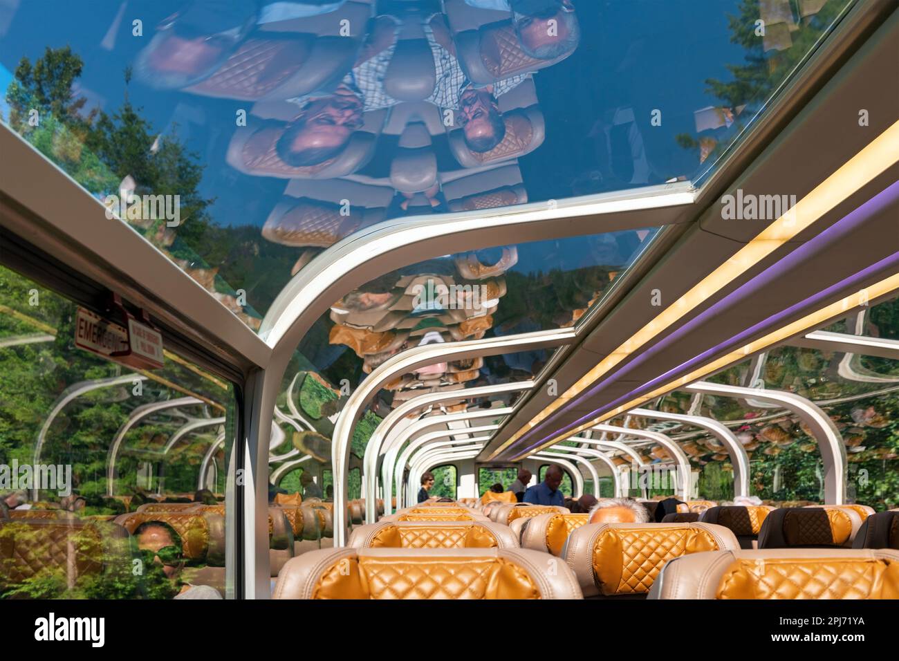 Interior of the panoramic gold leaf Rocky Mountaineer train wagon with ...