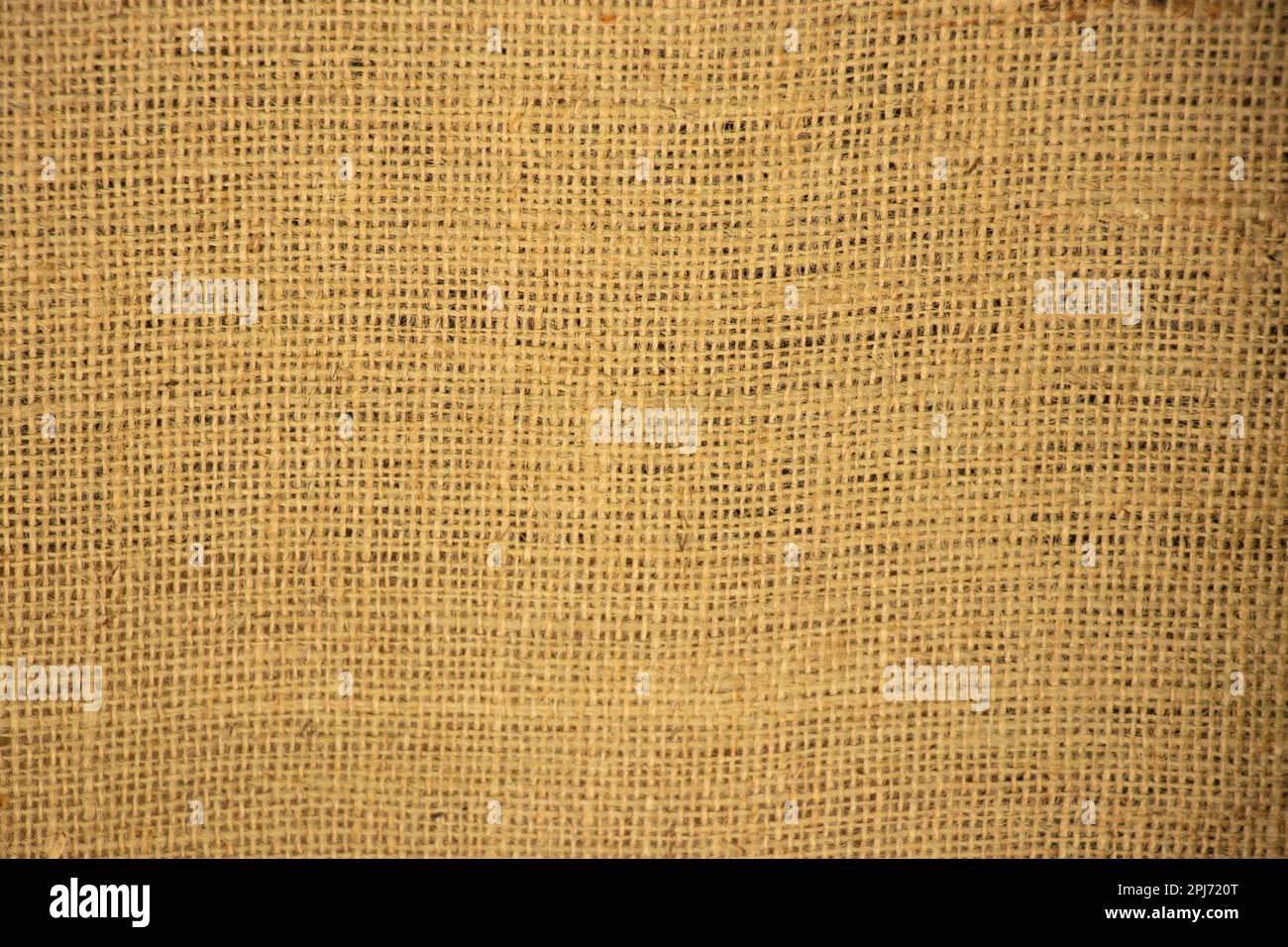 light beige burlap background in daylight close up Stock Photo - Alamy