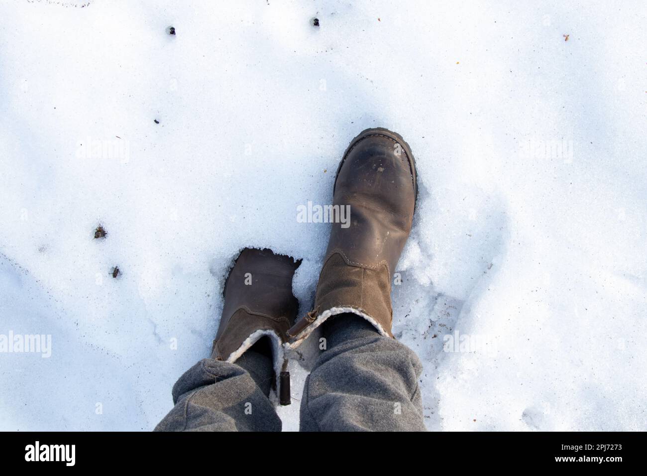 Girl in boots on snow hi-res stock photography and images - Alamy