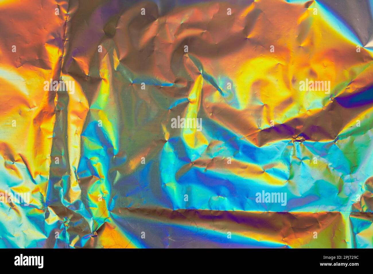 Multicolored foil folds background hi-res stock photography and images ...