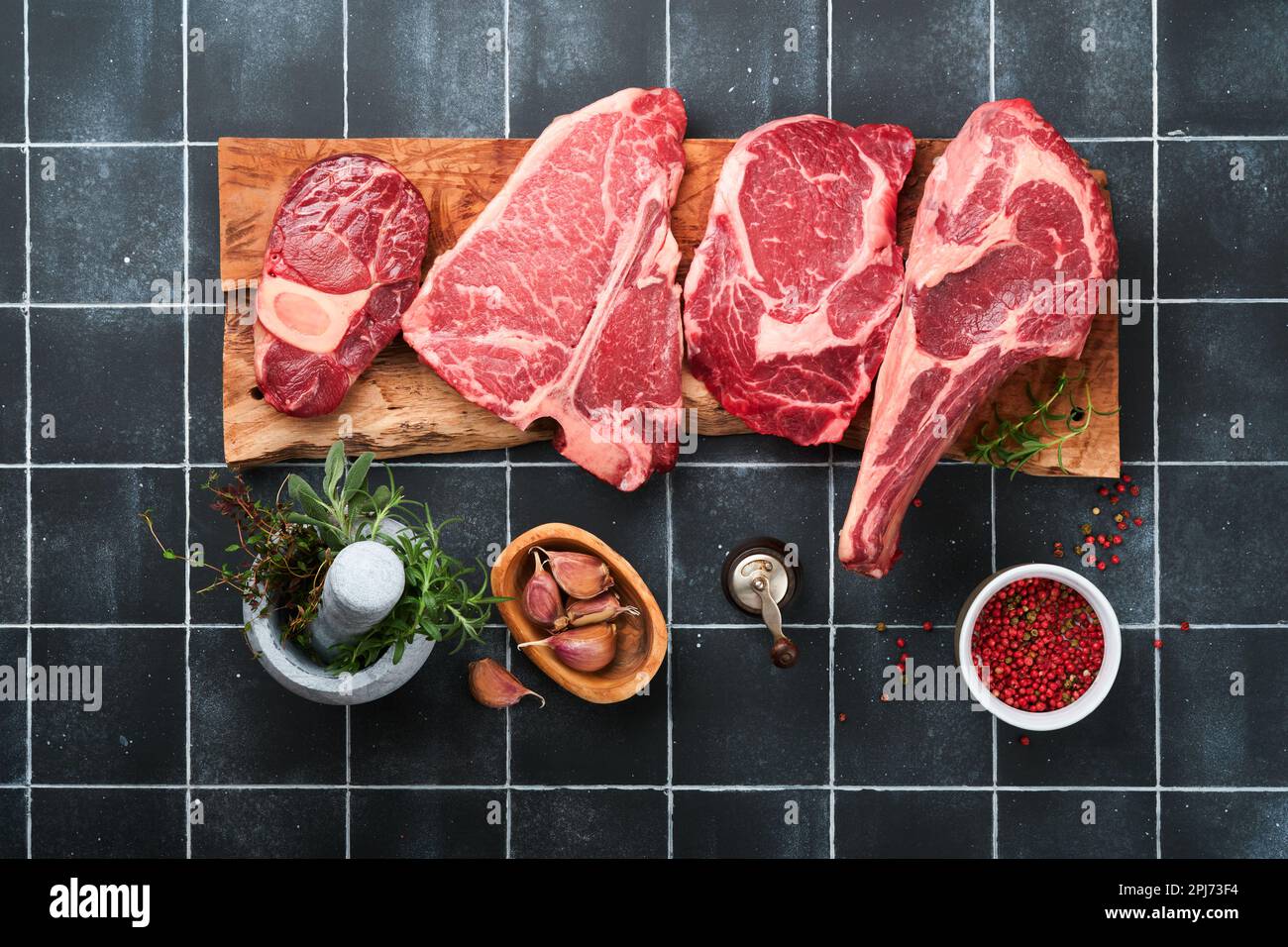 Raw prime steaks. Variety of fresh black angus prime meat steaks T-bone ...