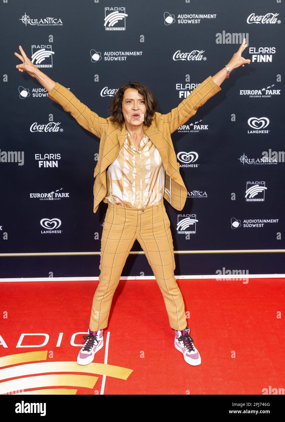 Rust, Germany. 31st Mar, 2023. Ulrike Folkerts stands on the red carpet ...