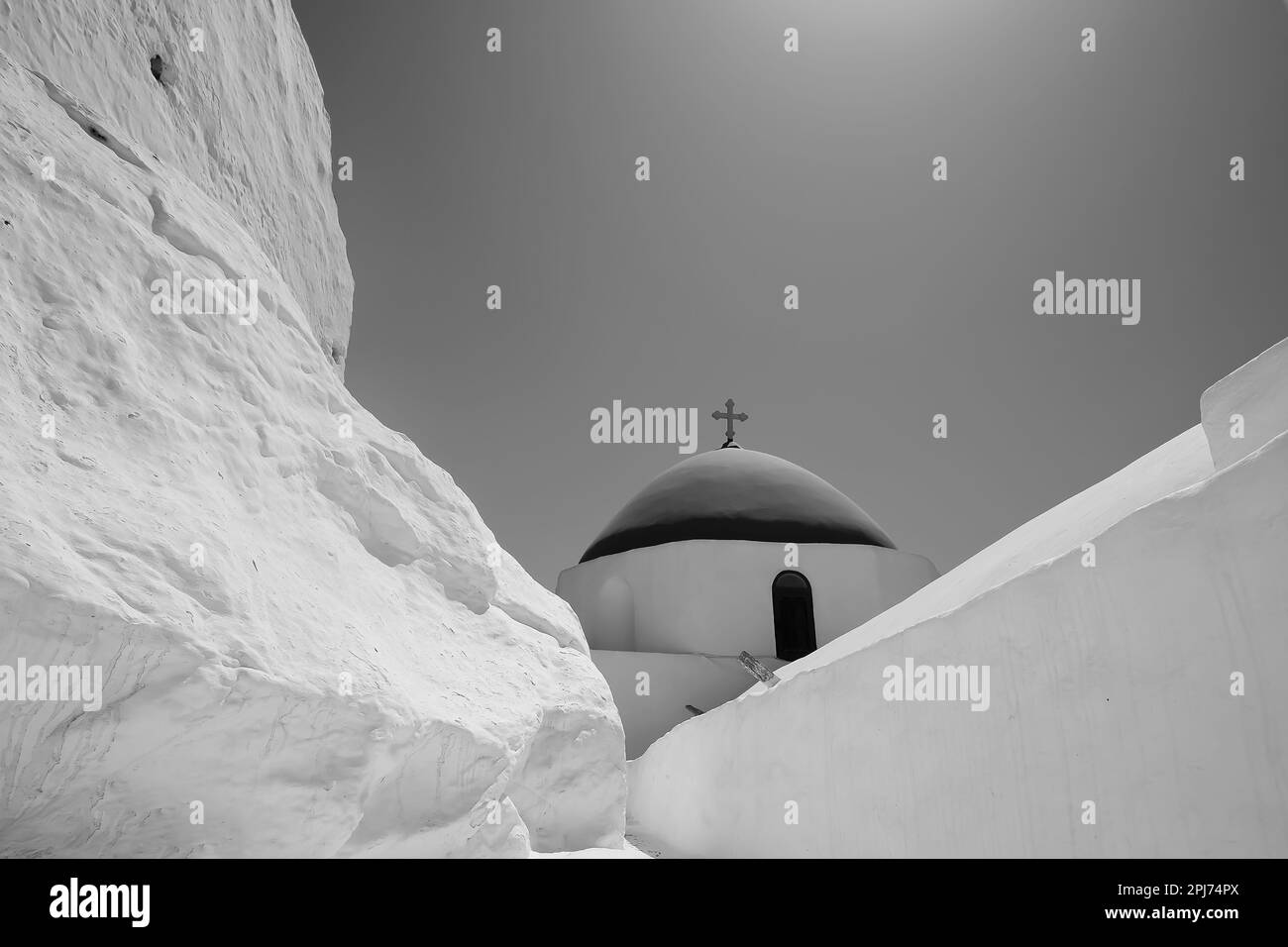 View of the top of an orthodox Greek church in Ios Greece in black and ...