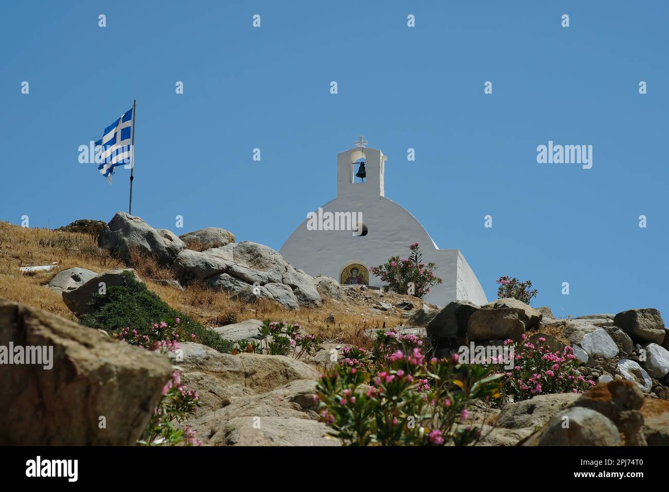 A small whitewashed church at the top of the hill next to the Greek ...