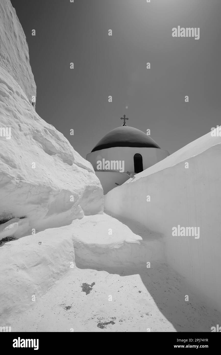 View of the top of an orthodox Greek church in Ios Greece in black and ...