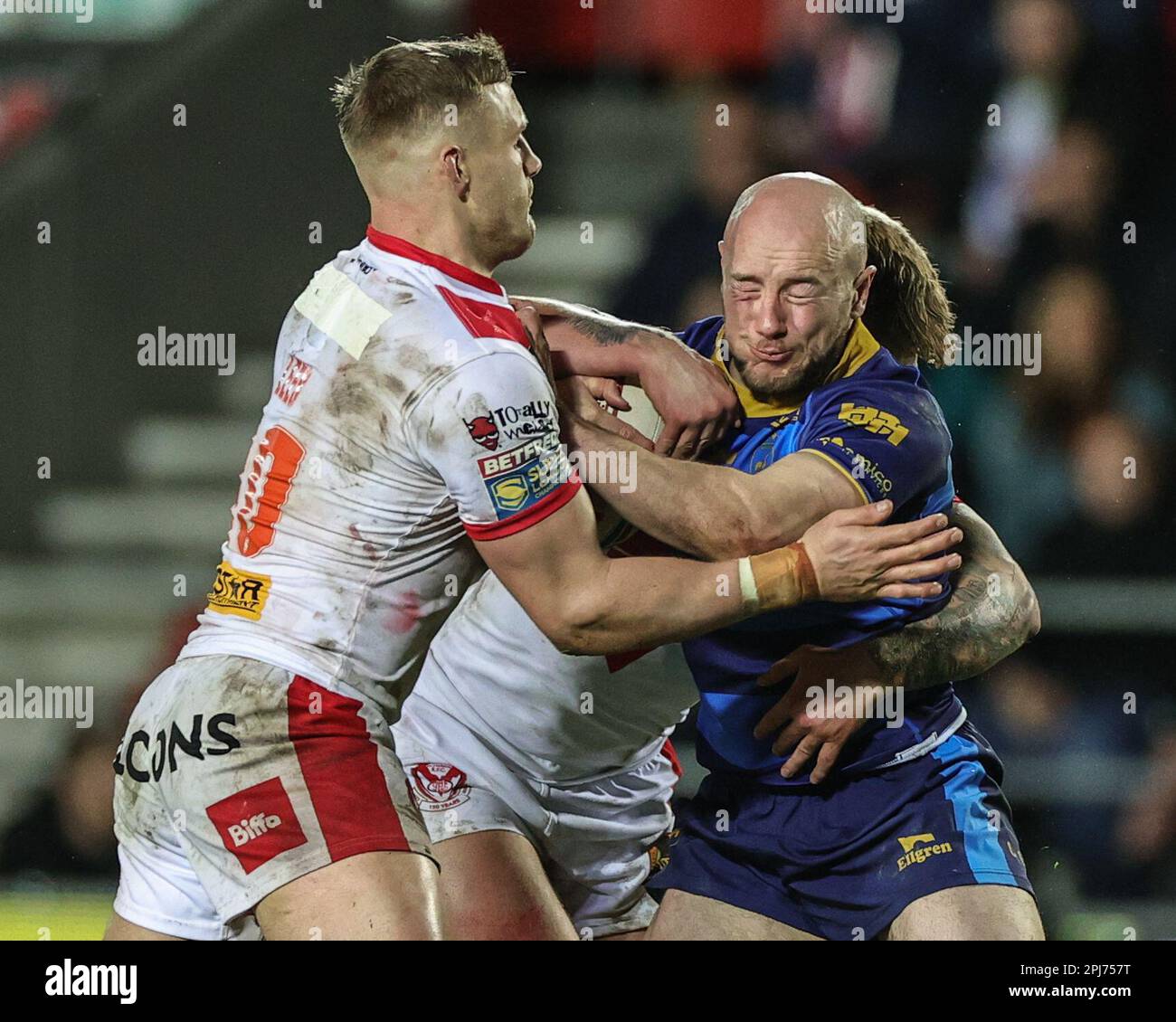 Lee Kershaw #18 of Wakefield Trinity is tackled by George Delaney #30 ...